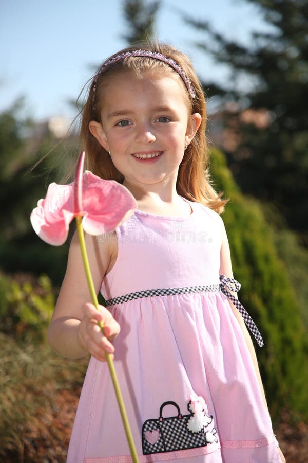 Little girl with flower stock photo. Image of blonde - 24543918