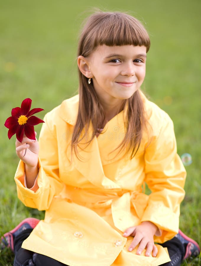 Little girl with flower stock photo. Image of human, grass - 36883868