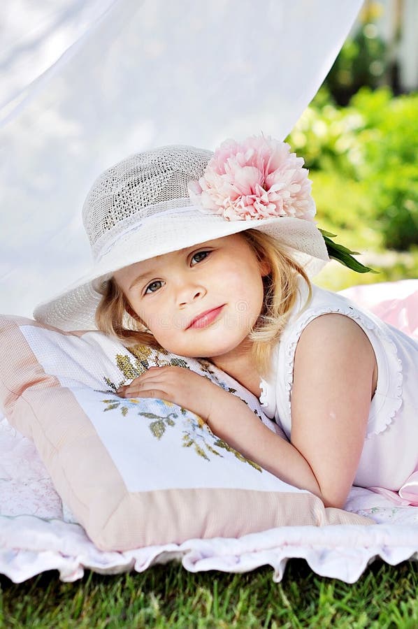Little girl with flowers stock image. Image of close - 28561687