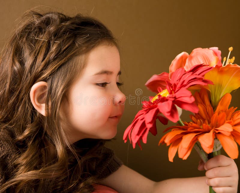 Little girl with flowers stock photo. Image of holding - 10304384