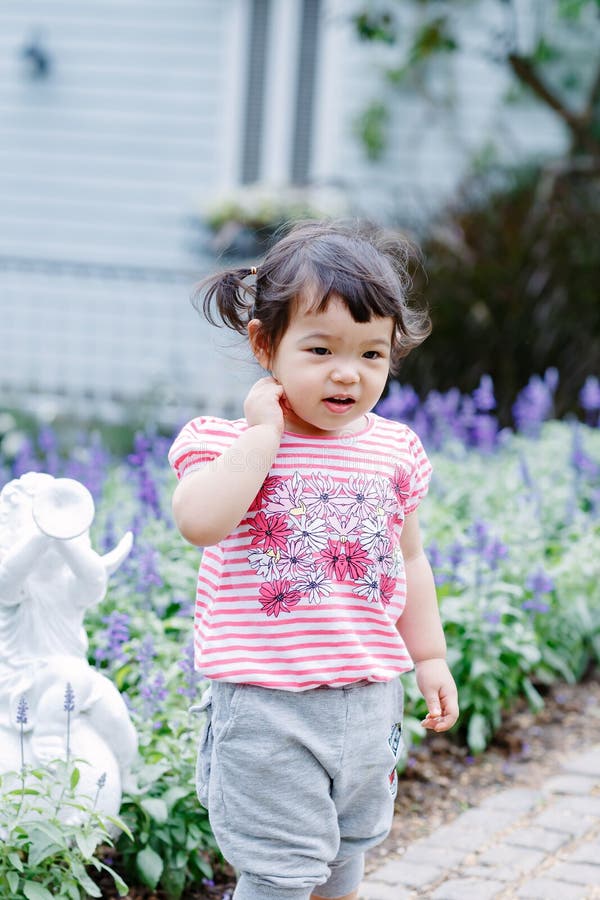 The Little Girl for Fun in the Garden. Stock Photo - Image of innocent ...