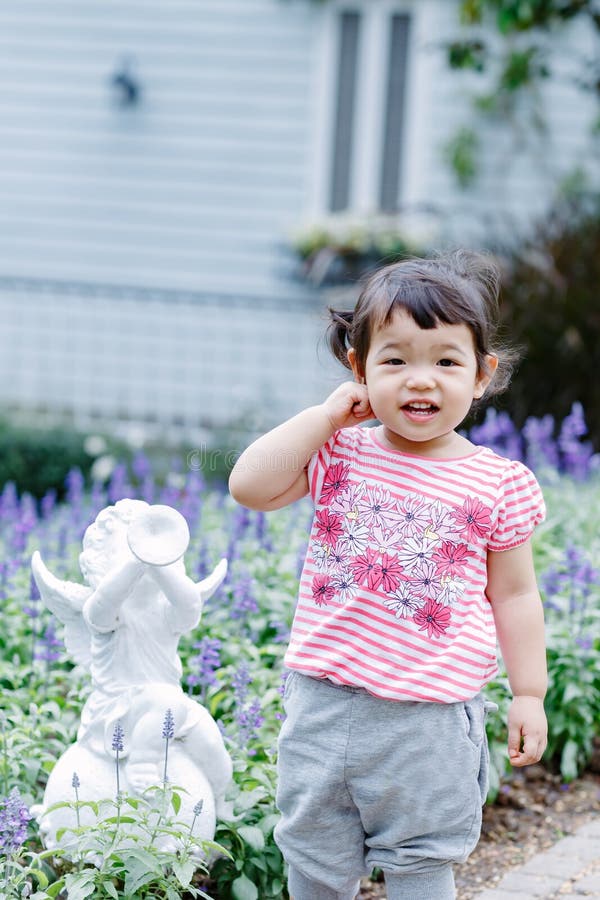 The Little Girl for Fun in the Garden. Stock Image - Image of hand ...
