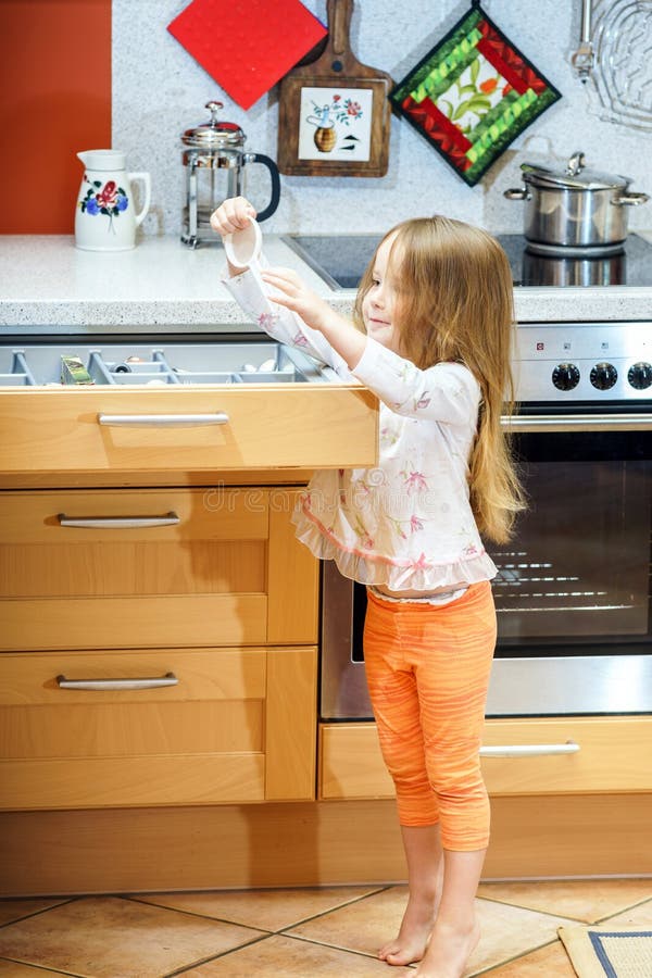 Little Girl Getting Tableware before Dinner Stock Image - Image of ...