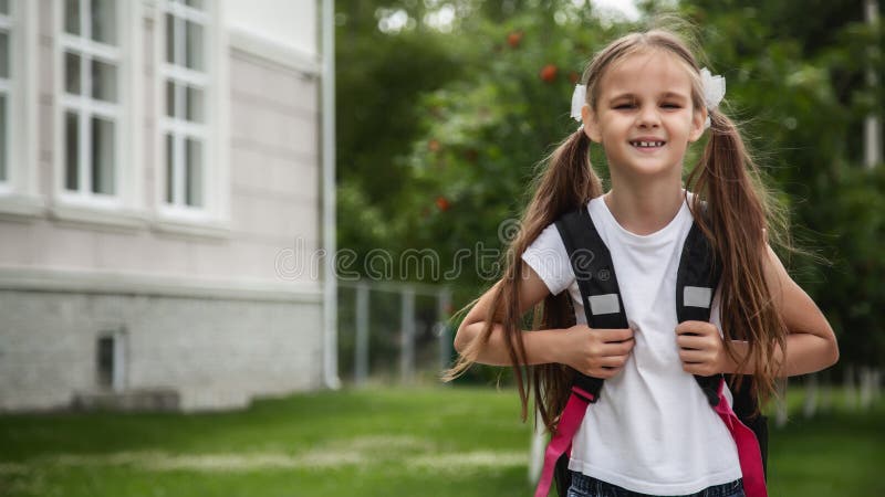 A Little Girl Goes To School with Her Backpack. the Girl First Class ...