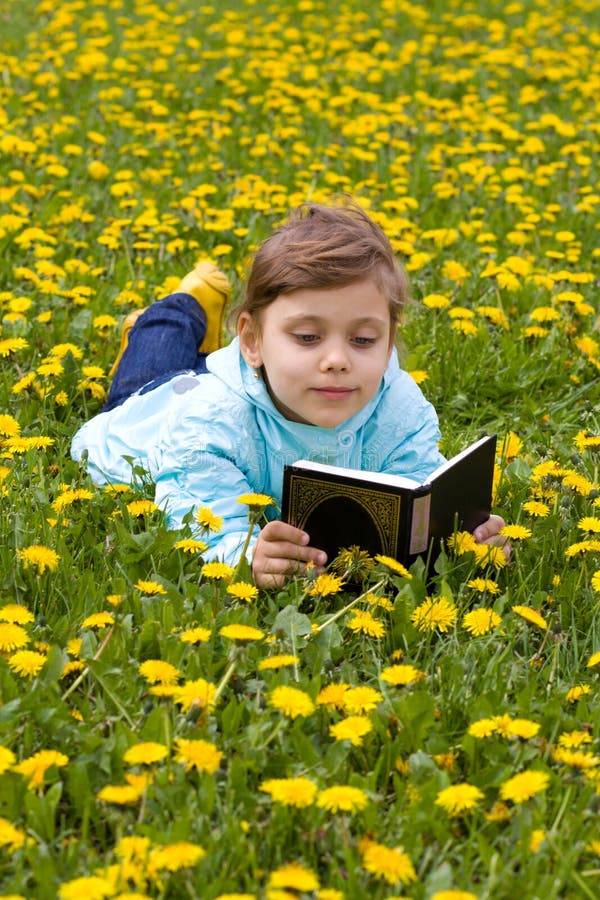 Little Girl on the Grass Reading Book Stock Photo - Image of efficiency ...