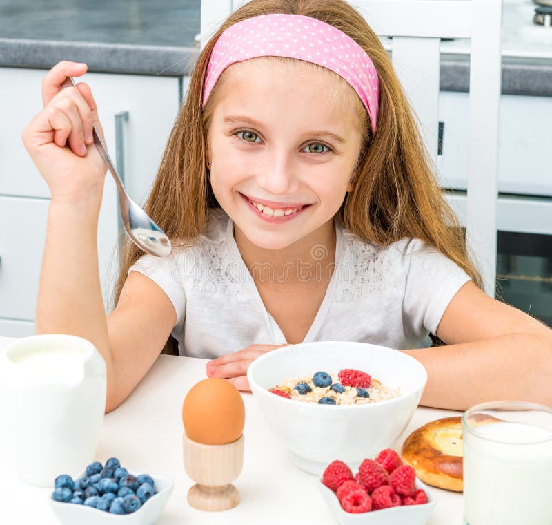 Little Girl Having Breakfast Stock Photo - Image of fruit, health: 61649292