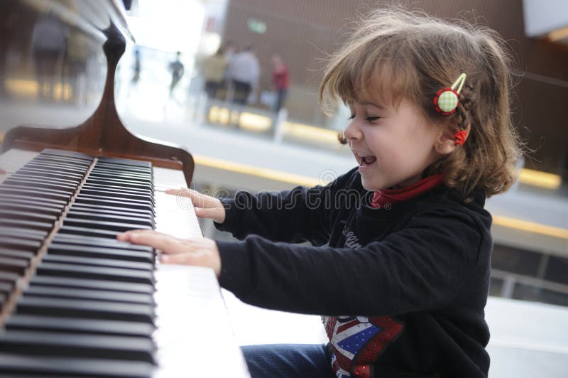 Little Girl Having Fun Playing the Piano Stock Photo - Image of ...