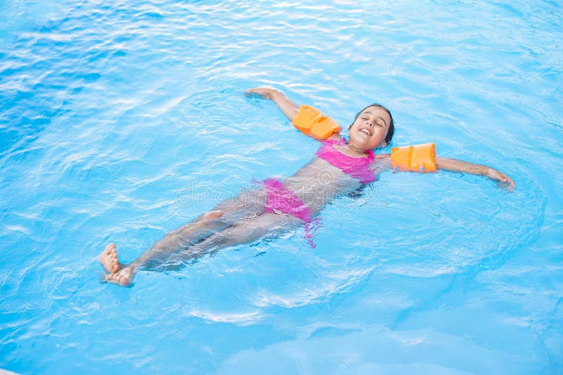 Little Girl Having Fun in the Pool Stock Photo - Image of cute, lying ...