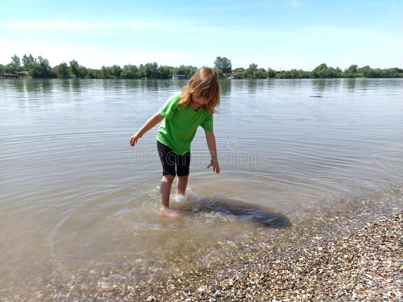 Little Girl Having Fun by a River at Summer Stock Photo - Image of ...