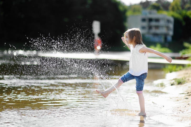 Little Girl Having Fun by a River Stock Image - Image of bank, active ...