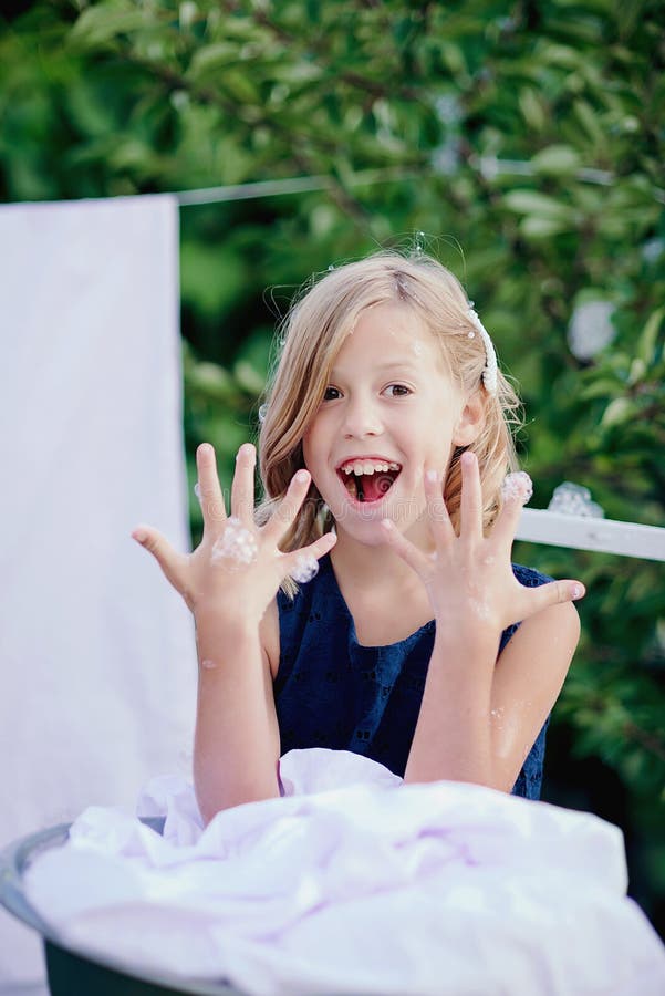 Girl are Having Fun and Smiling while Doing Laundry Stock Image - Image ...