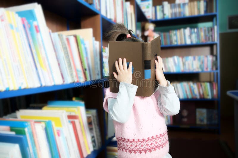 Little Girl Hide Behind Book in Library Environment Stock Image - Image ...