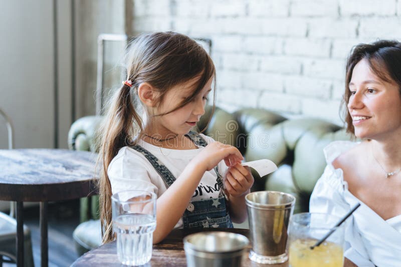 Little Girl Holding a Check in Her Hands Stock Image - Image of ...