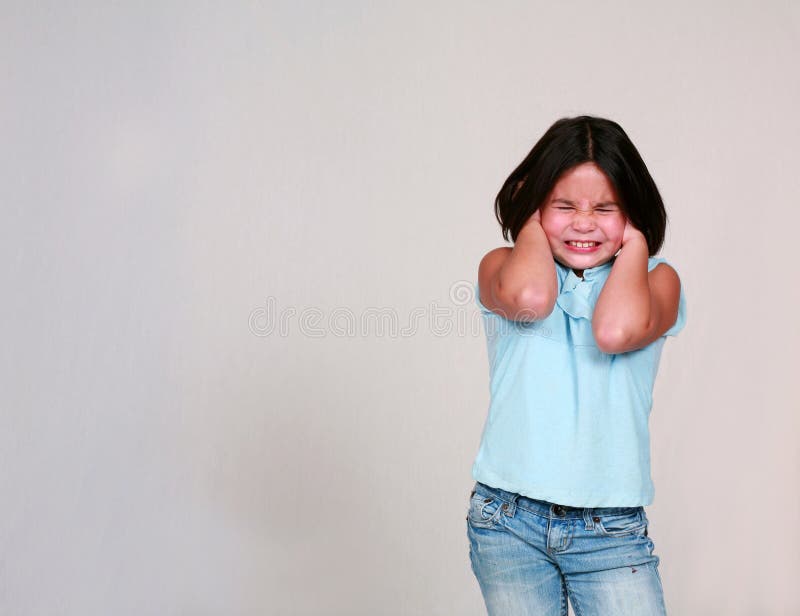 Little Girl Holding Ears stock photo. Image of emotion - 7235560