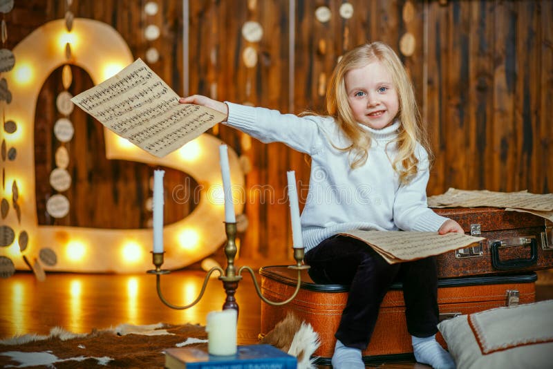 Little Girl Holding a Note in Vintage Interior Stock Photo - Image of ...