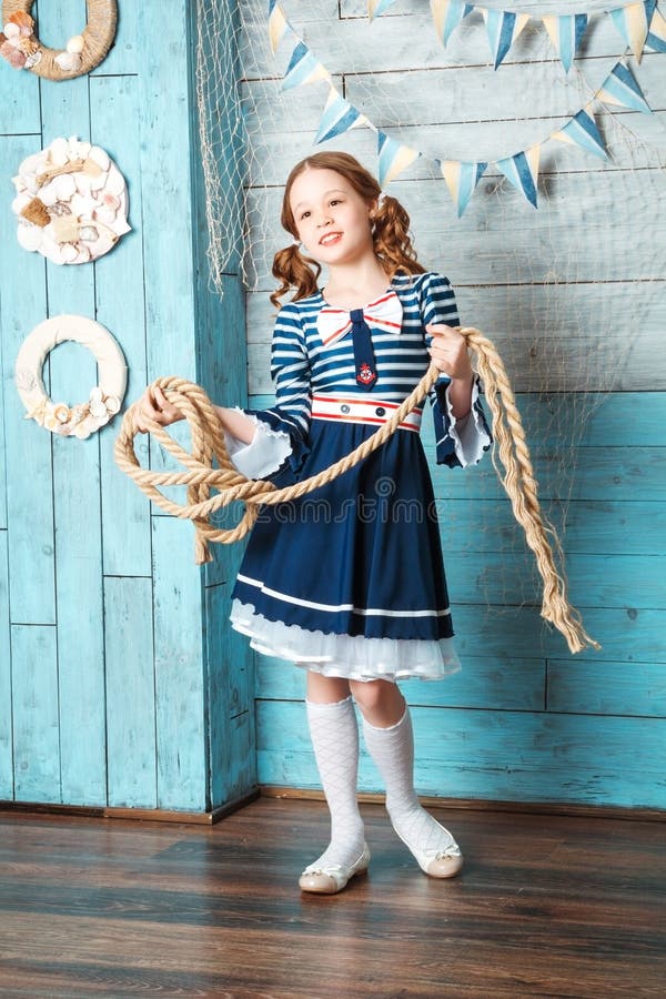 Little girl holding a rope stock photo. Image of nautical - 71660960