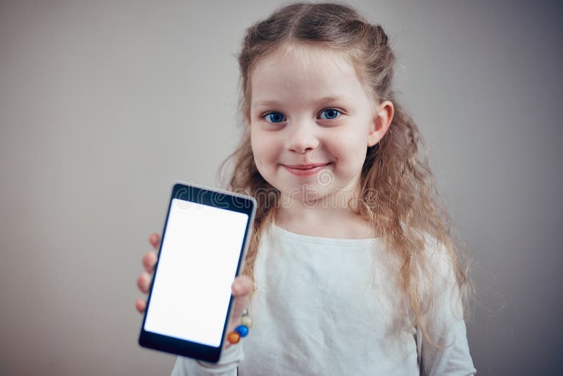 Little Girl Holding a Smartphone with a White Screen Stock Image ...