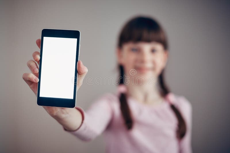Little Girl Holding a Smartphone with a White Screen. Stock Image ...