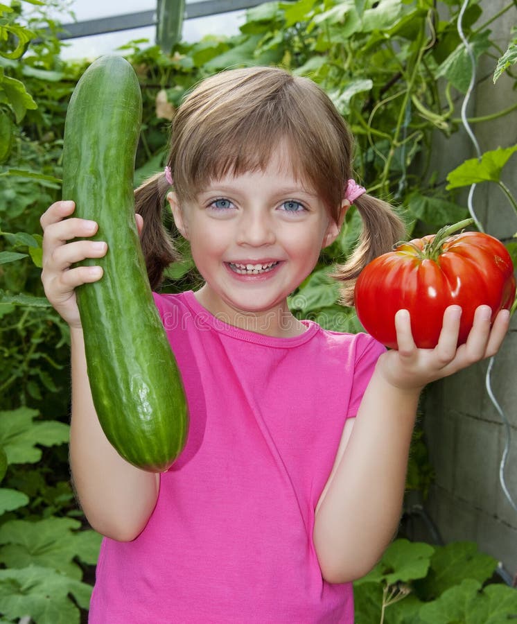 Little Girl Holding Vegetables Stock Photo - Image of greenhouse ...