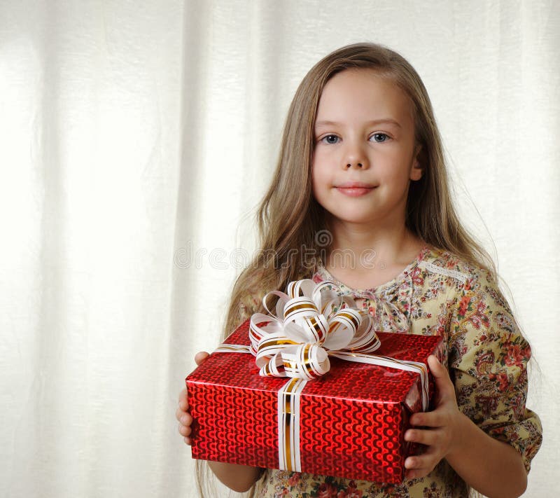 Little Girl Holds a Red Box with a Gift Stock Image - Image of ...