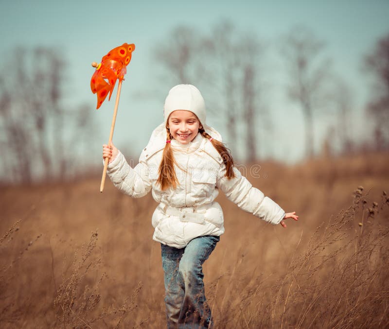 Little Girl Holds Windmill in Hand Stock Photo - Image of cute, small ...