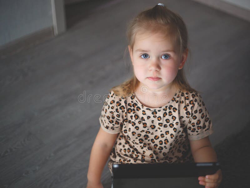 Little Girl at Home Watching Tablet Computer. Home Schooling, Distance ...