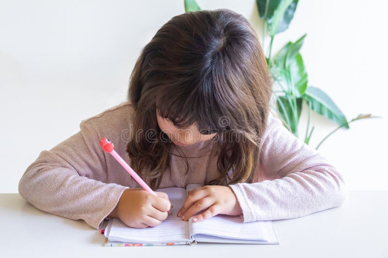 Little Girl at Home Writing in a Notebook Stock Image - Image of girls ...