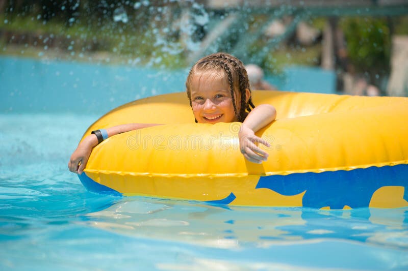 Little Girl Sitting on Inflatable Ring Stock Image - Image of smile ...