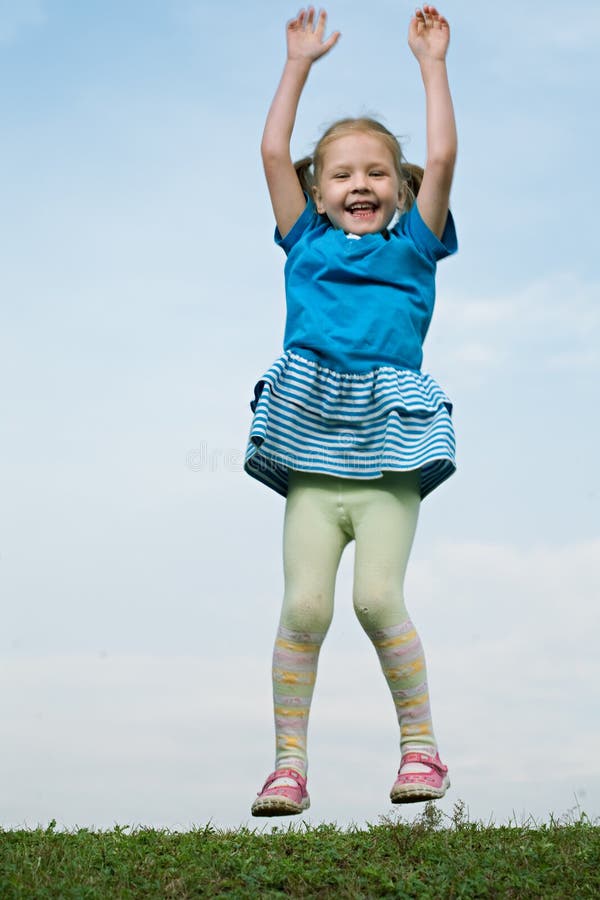 Little Girl Jump Om Grass Picture. Image: 16043839