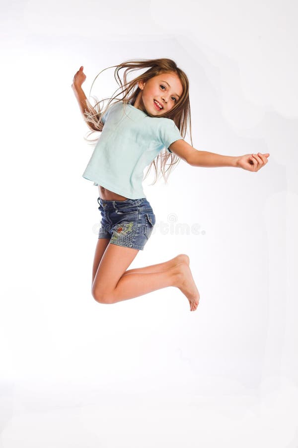 Little girl jumping of joy stock image. Image of gravity - 5303817