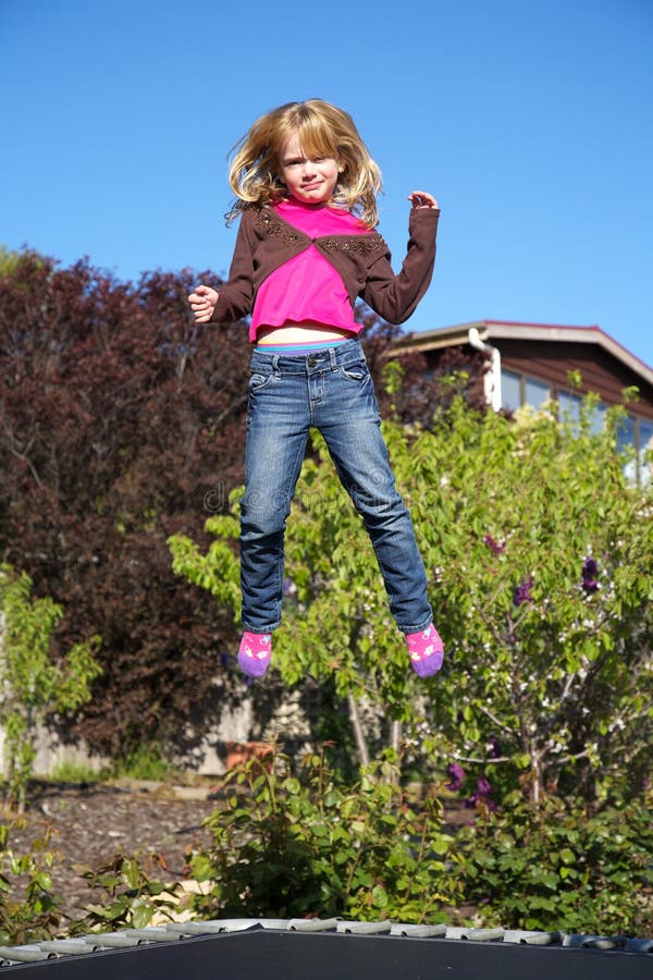 Little Girl Jumping on Trampoline Stock Photo - Image of garden ...