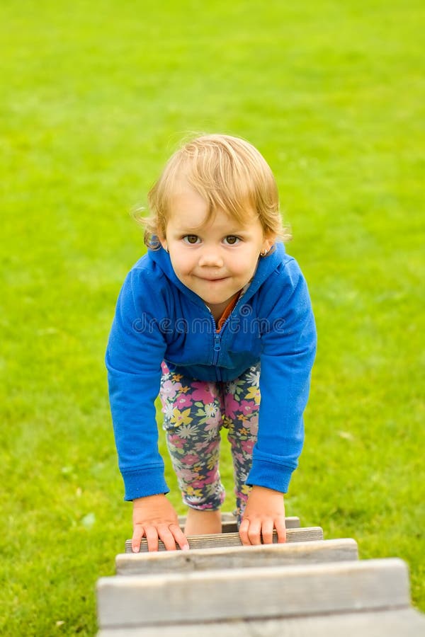 Little girl on ladder stock photo. Image of green, funny - 56066996