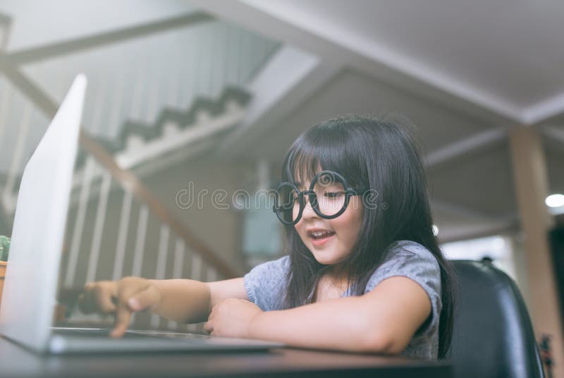 Little Girl with Laptop Working at Home Stock Photo - Image of house ...
