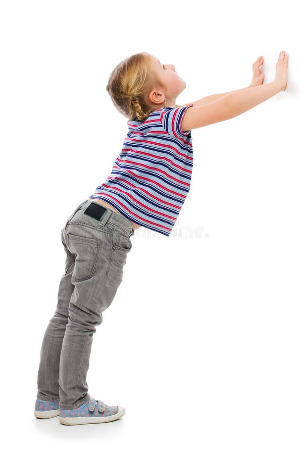 Little Girl Leaning Against a White Wall. Stock Photo - Image of girl ...