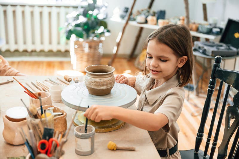 Painting the Product. Mother with Little Girl Making Ceramic Pot at ...
