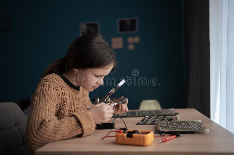 Little Girl Learning How To Solder Microprocessor Cables and Printed ...