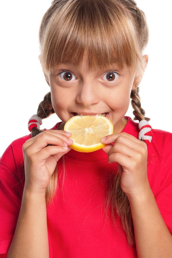 Little girl with lemon stock image. Image of eating, child - 27178035