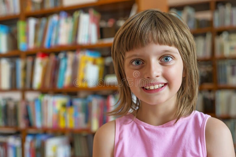 Little girl in a library stock image. Image of fairy - 58488757