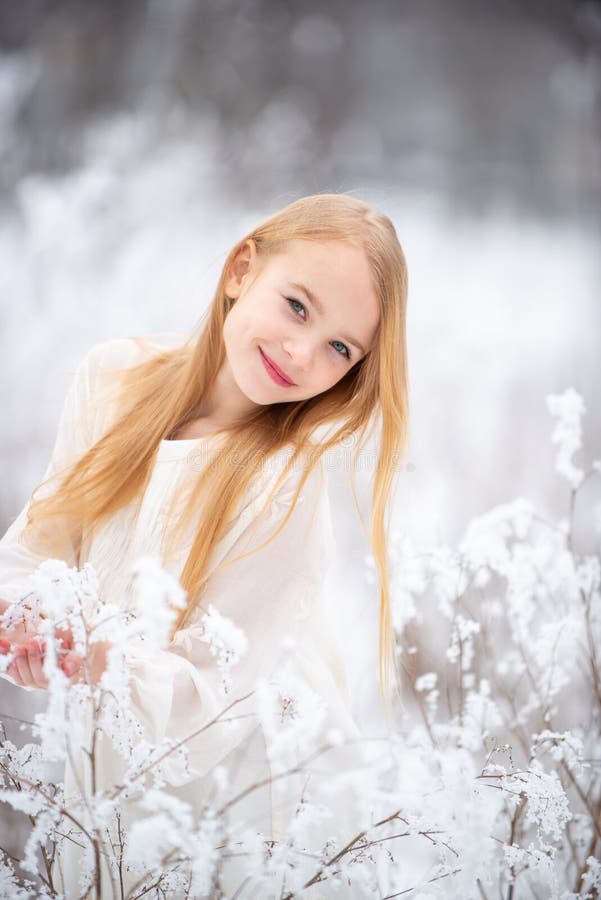Little Girl in Light and Snow Stock Image - Image of face, holiday ...