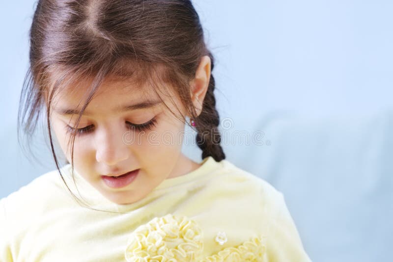 Little girl looking down stock image. Image of child - 11721571