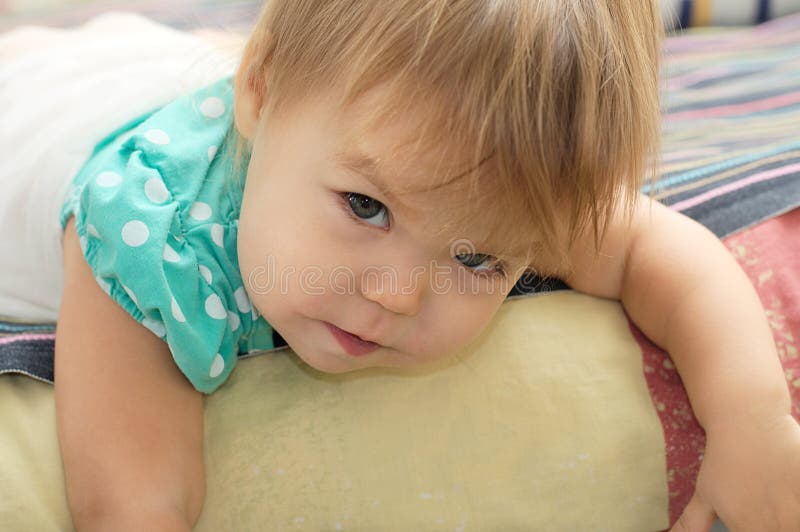 Little girl looking slyly stock photo. Image of smile - 62923356