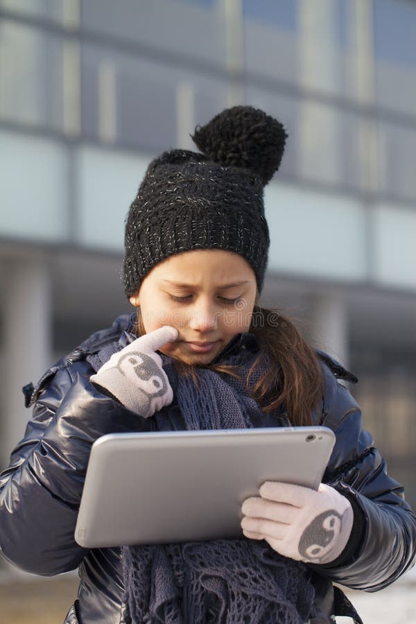 Little Girl Looking at Tablet Stock Image - Image of portrait, computer ...