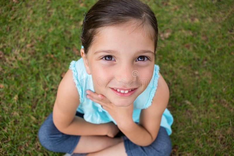 Little Girl Looking Up at Camera Stock Photo - Image of smiling, bright ...