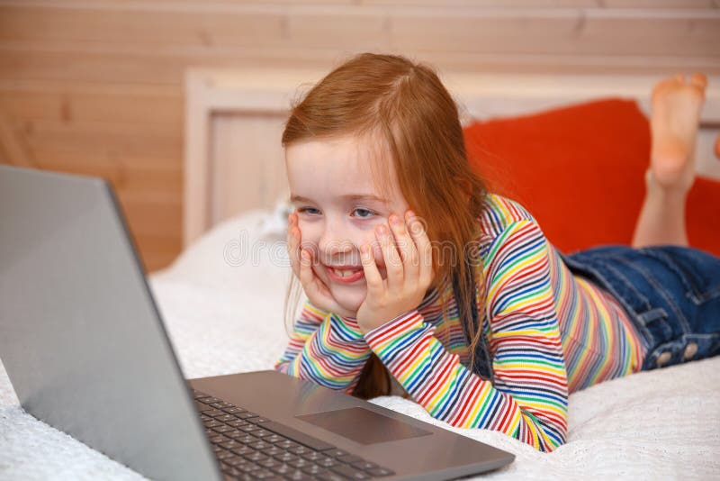 A Little Girl Looks at the Computer with Different Emotions Stock Image ...