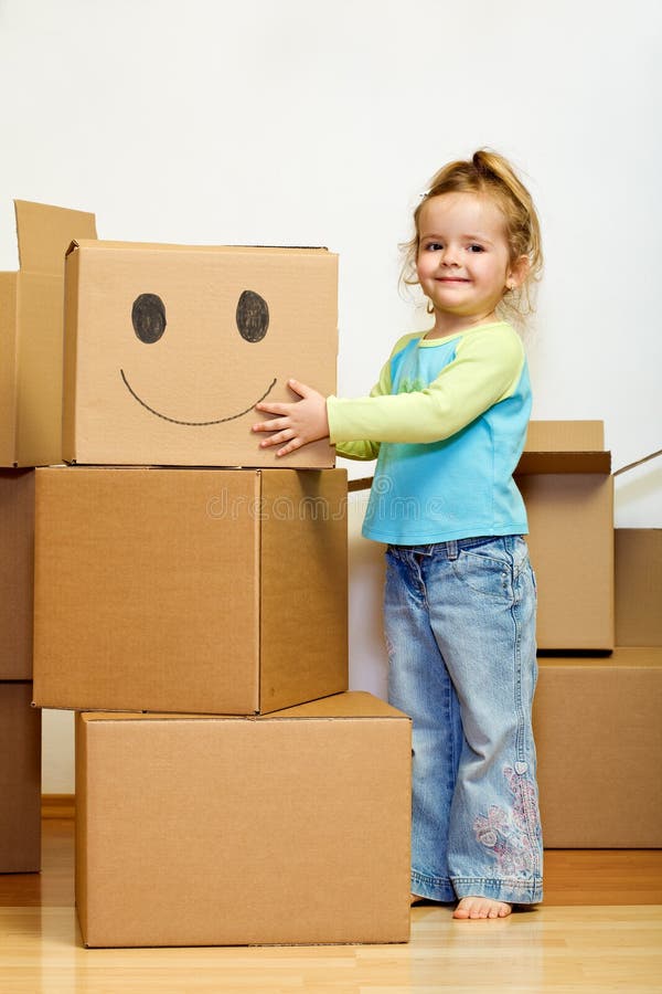 Little Girl with Lots of Cardboard Boxes Grimacing Stock Photo - Image ...