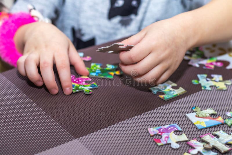 A Little Girl Makes Puzzles. Educational Games for Children Stock Image ... A Little Girl Makes Puzzles. Educational Games for Children Stock Image ...