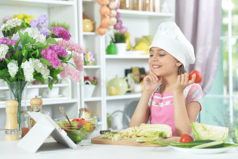 Little Girl Making Dinner on Kitchen Table at Home Stock Image - Image ...