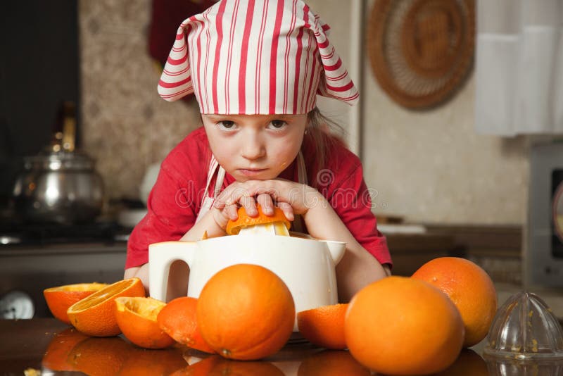 Little Girl Making Fresh Juice Stock Image - Image of apron, people ...