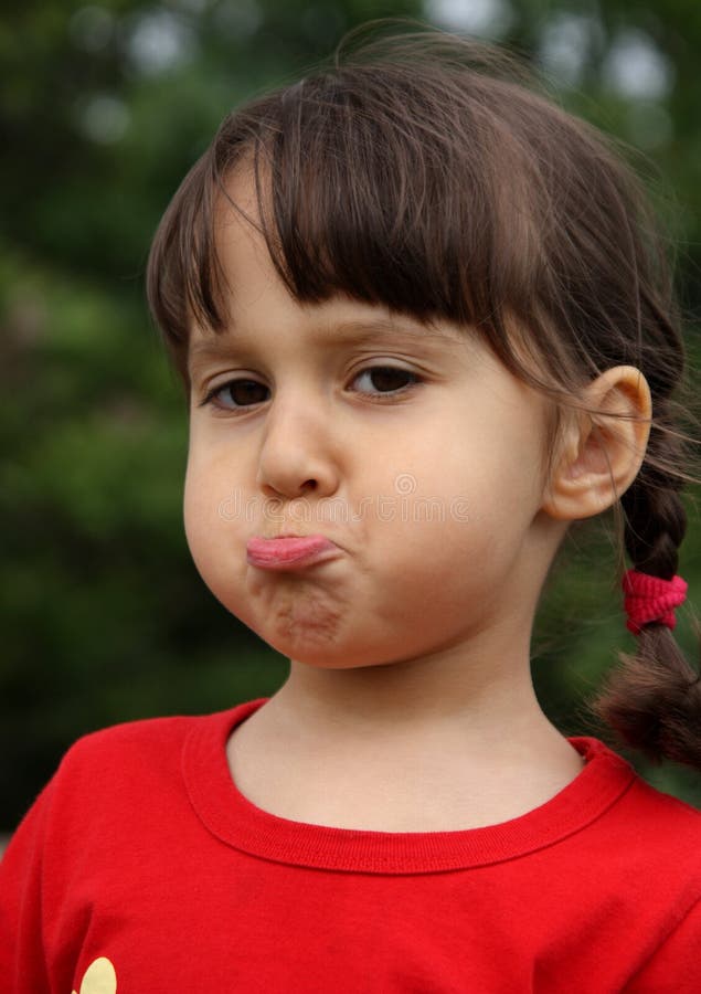 Little Girl Making Funny Face Stock Image - Image of head, looking ...