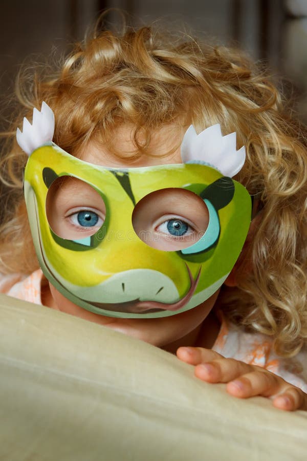 A little girl in mask stock photo. Image of leisure, green - 24828440